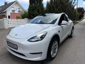 White Tesla Model Y 2023 in Kaunas, with an engine capacity of 0.00 L and mileage of 52 thousand km for 37700 €, photo  on AUTOMOTO.COM.LV