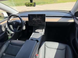 White Tesla Model Y 2023 in Kaunas, with an engine capacity of 0.00 L and mileage of 52 thousand km for 37700 €, photo 12 on AUTOMOTO.COM.LV