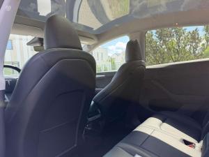 White Tesla Model Y 2023 in Kaunas, with an engine capacity of 0.00 L and mileage of 52 thousand km for 37700 €, photo 30 on AUTOMOTO.COM.LV