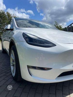 White Tesla Model Y 2023 in Kaunas, with an engine capacity of 0.00 L and mileage of 58 thousand km for 31500 €, photo 14 on AUTOMOTO.COM.LV