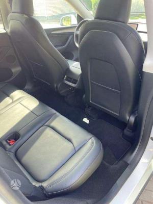 White Tesla Model Y 2023 in Kaunas, with an engine capacity of 0.00 L and mileage of 58 thousand km for 31500 €, photo 16 on AUTOMOTO.COM.LV