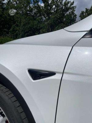 White Tesla Model Y 2023 in Kaunas, with an engine capacity of 0.00 L and mileage of 58 thousand km for 31500 €, photo 17 on AUTOMOTO.COM.LV