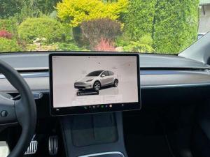 White Tesla Model Y 2023 in Kaunas, with an engine capacity of 0.00 L and mileage of 58 thousand km for 31500 €, photo 20 on AUTOMOTO.COM.LV