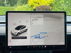 White Tesla Model Y 2023 in Kaunas, with an engine capacity of 0.00 L and mileage of 58 thousand km for 31500 €, photo 21 on AUTOMOTO.COM.LV