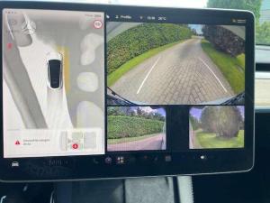 White Tesla Model Y 2023 in Kaunas, with an engine capacity of 0.00 L and mileage of 58 thousand km for 31500 €, photo 23 on AUTOMOTO.COM.LV