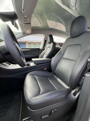 White Tesla Model Y 2023 in Kaunas, with an engine capacity of 0.00 L and mileage of 90 thousand km for 23490 €, photo 12 on AUTOMOTO.COM.LV