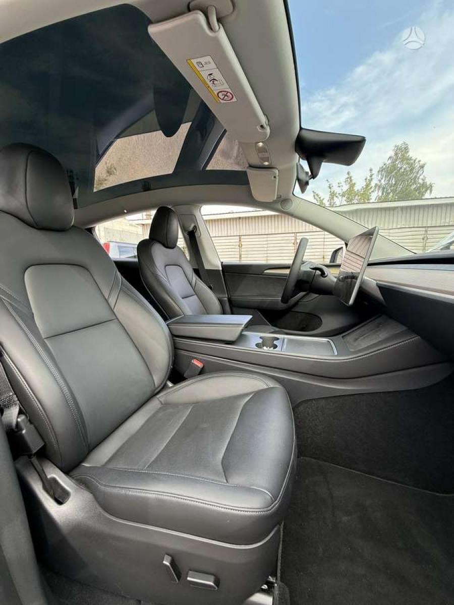 White Tesla Model Y 2023 in Kaunas, with an engine capacity of 0.00 L and mileage of 90 thousand km for 23490 €, photo 14 on AUTOMOTO.COM.LV