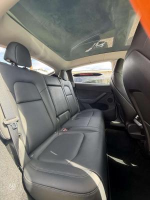 White Tesla Model Y 2023 in Kaunas, with an engine capacity of 0.00 L and mileage of 90 thousand km for 23490 €, photo 16 on AUTOMOTO.COM.LV