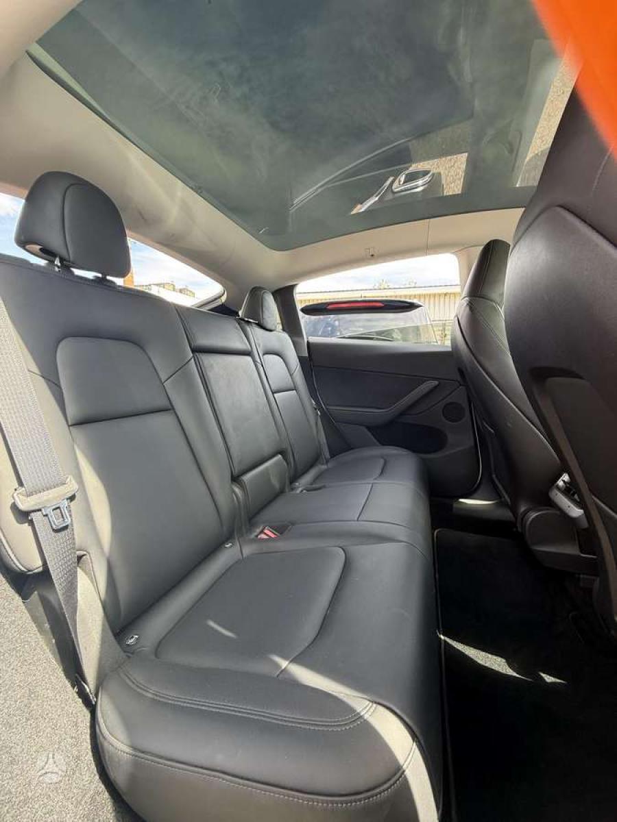 White Tesla Model Y 2023 in Kaunas, with an engine capacity of 0.00 L and mileage of 90 thousand km for 23490 €, photo 16 on AUTOMOTO.COM.LV