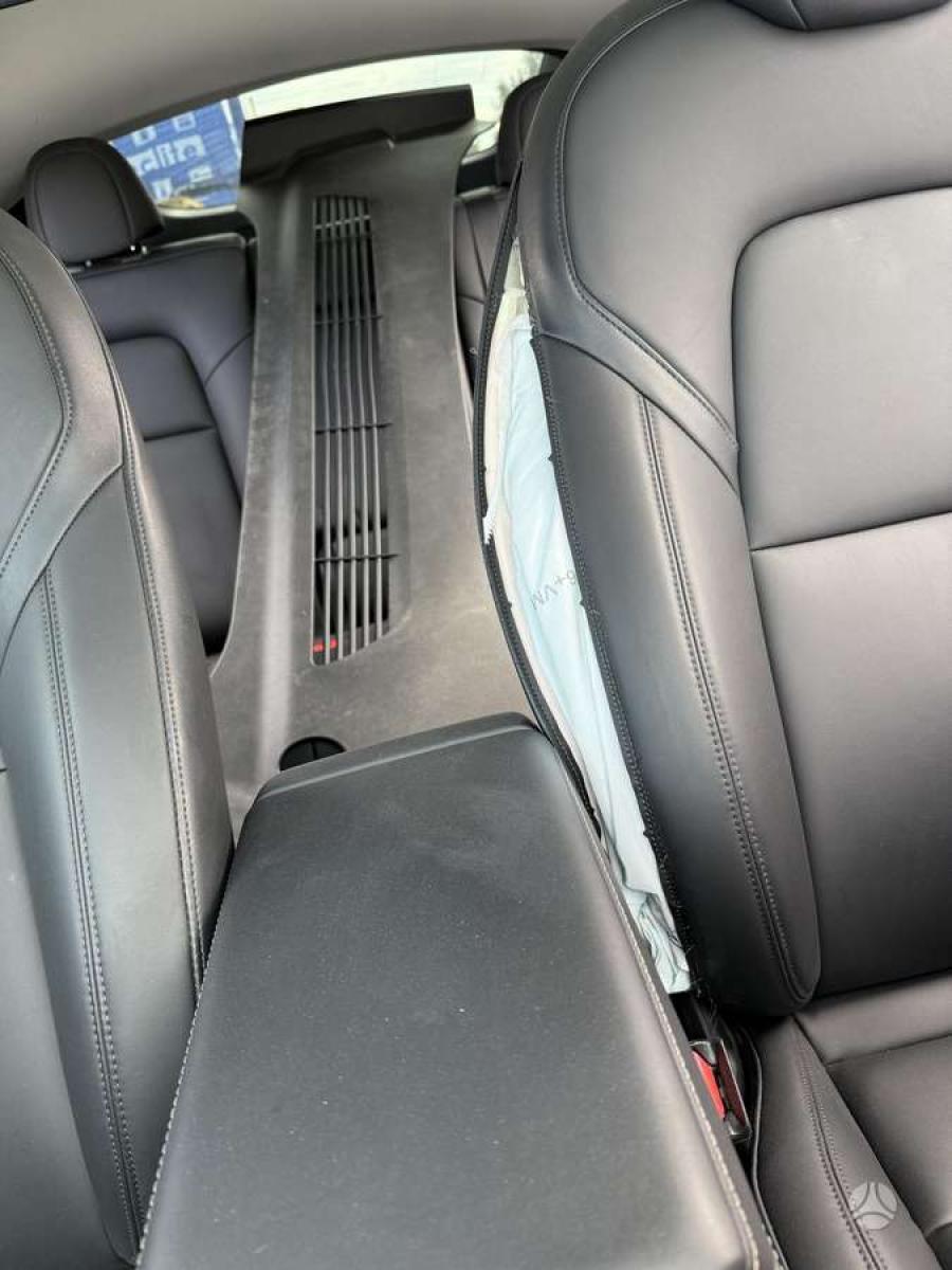 White Tesla Model Y 2023 in Kaunas, with an engine capacity of 0.00 L and mileage of 77 thousand km for 22990 €, photo 13 on AUTOMOTO.COM.LV