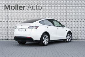 White Tesla Model Y 2023 in Marupe, with an engine capacity of 0.00 L and mileage of 78 thousand km for 41200 €, photo 5 on AUTOMOTO.COM.LV