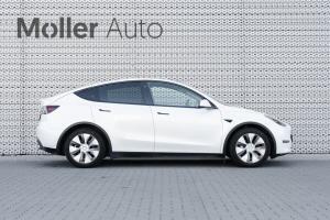 White Tesla Model Y 2023 in Marupe, with an engine capacity of 0.00 L and mileage of 78 thousand km for 41200 €, photo 6 on AUTOMOTO.COM.LV