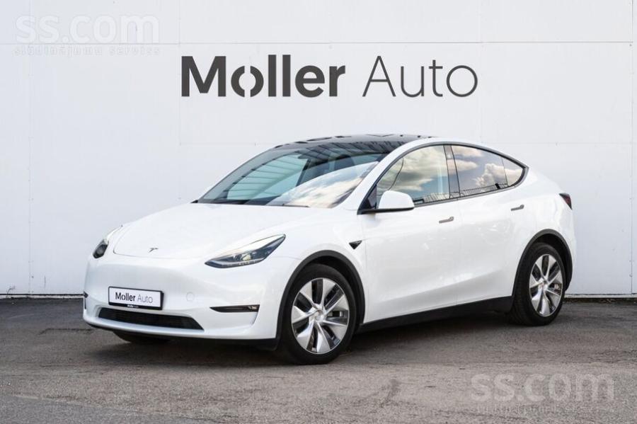 White Tesla Model Y 2023 in Riga, with an engine capacity of 0.00 L and mileage of 62 thousand km for 39500 €, photo 1 on AUTOMOTO.COM.LV