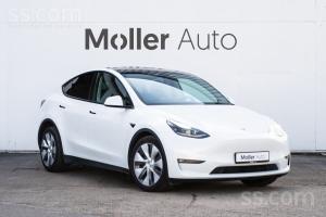White Tesla Model Y 2023 in Riga, with an engine capacity of 0.00 L and mileage of 62 thousand km for 39500 €, photo 3 on AUTOMOTO.COM.LV