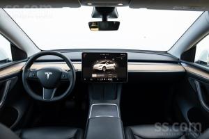 White Tesla Model Y 2023 in Riga, with an engine capacity of 0.00 L and mileage of 62 thousand km for 39500 €, photo 12 on AUTOMOTO.COM.LV