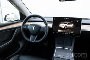 White Tesla Model Y 2023 in Riga, with an engine capacity of 0.00 L and mileage of 62 thousand km for 39500 €, photo 13 on AUTOMOTO.COM.LV