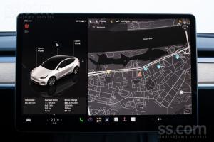 White Tesla Model Y 2023 in Riga, with an engine capacity of 0.00 L and mileage of 62 thousand km for 39500 €, photo 18 on AUTOMOTO.COM.LV