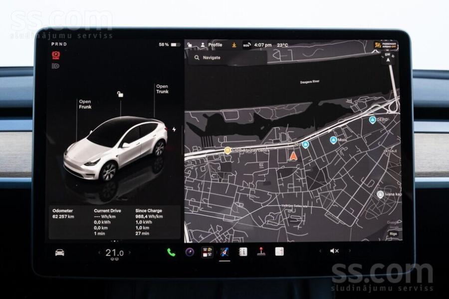 White Tesla Model Y 2023 in Riga, with an engine capacity of 0.00 L and mileage of 62 thousand km for 39500 €, photo 18 on AUTOMOTO.COM.LV