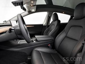 White Tesla Model Y 2023 in Riga, with an engine capacity of 0.00 L and mileage of 19 thousand km for 32900 €, photo 9 on AUTOMOTO.COM.LV