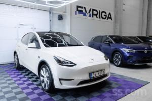White Tesla Model Y 2023 in Riga, with an engine capacity of 0.00 L and mileage of 41 thousand km for 36490 €, photo  on AUTOMOTO.COM.LV