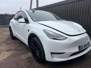 White Tesla Model Y 2024 in Kaunas, with an engine capacity of 0.00 L and mileage of 79 thousand km for 17500 €, photo  on AUTOMOTO.COM.LV