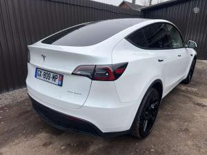 White Tesla Model Y 2024 in Kaunas, with an engine capacity of 0.00 L and mileage of 79 thousand km for 17500 €, photo 7 on AUTOMOTO.COM.LV