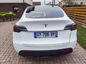 White Tesla Model Y 2024 in Kaunas, with an engine capacity of 0.00 L and mileage of 34 thousand km for 12300 €, photo 6 on AUTOMOTO.COM.LV
