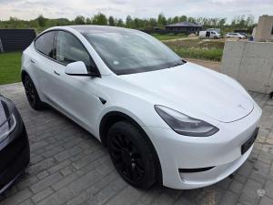 White Tesla Model Y 2024 in Kaunas, with an engine capacity of 0.00 L and mileage of 45 thousand km for 29900 €, photo  on AUTOMOTO.COM.LV