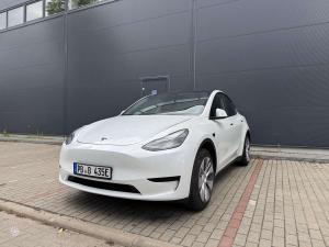 White Tesla Model Y 2024 in Kaunas, with an engine capacity of 0.00 L and mileage of 54 thousand km for 31500 €, photo  on AUTOMOTO.COM.LV