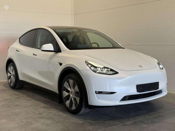 White Tesla Model Y 2024 in Vilnius, with an engine capacity of 0.00 L and mileage of 66 thousand km for 33950 €, photo 1 on AUTOMOTO.COM.LV