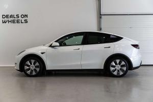 White Tesla Model Y 2024 in Vilnius, with an engine capacity of 0.00 L and mileage of 68 thousand km for 36900 €, photo 5 on AUTOMOTO.COM.LV