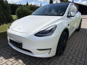 White Tesla Model Y 2024 in Alytus, with an engine capacity of 0.00 L and mileage of 25 thousand km for 35600 €, photo  on AUTOMOTO.COM.LV