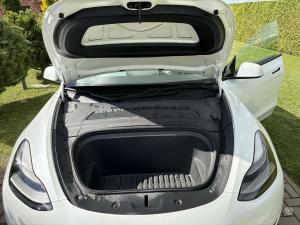 White Tesla Model Y 2024 in Alytus, with an engine capacity of 0.00 L and mileage of 25 thousand km for 35600 €, photo 21 on AUTOMOTO.COM.LV