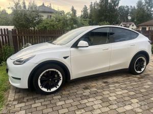 White Tesla Model Y 2021 in Riga, with an engine capacity of 0.00 L and mileage of 193 thousand km for 26000 €, photo  on AUTOMOTO.COM.LV
