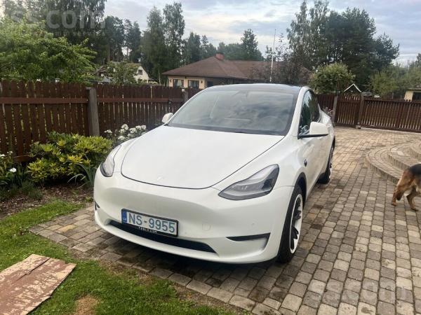White Tesla Model Y 2021 in Riga, with an engine capacity of 0.00 L and mileage of 193 thousand km for 26000 €, photo 2 on AUTOMOTO.COM.LV