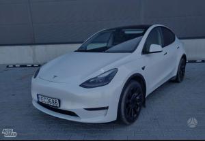 White Tesla Model Y 2022 in Siauliai, with an engine capacity of 0.00 L and mileage of 100 thousand km for 28500 €, photo  on AUTOMOTO.COM.LV