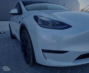 White Tesla Model Y 2022 in Siauliai, with an engine capacity of 0.00 L and mileage of 100 thousand km for 27500 €, photo 5 on AUTOMOTO.COM.LV