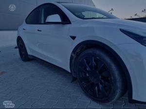 White Tesla Model Y 2022 in Siauliai, with an engine capacity of 0.00 L and mileage of 100 thousand km for 27500 €, photo 6 on AUTOMOTO.COM.LV