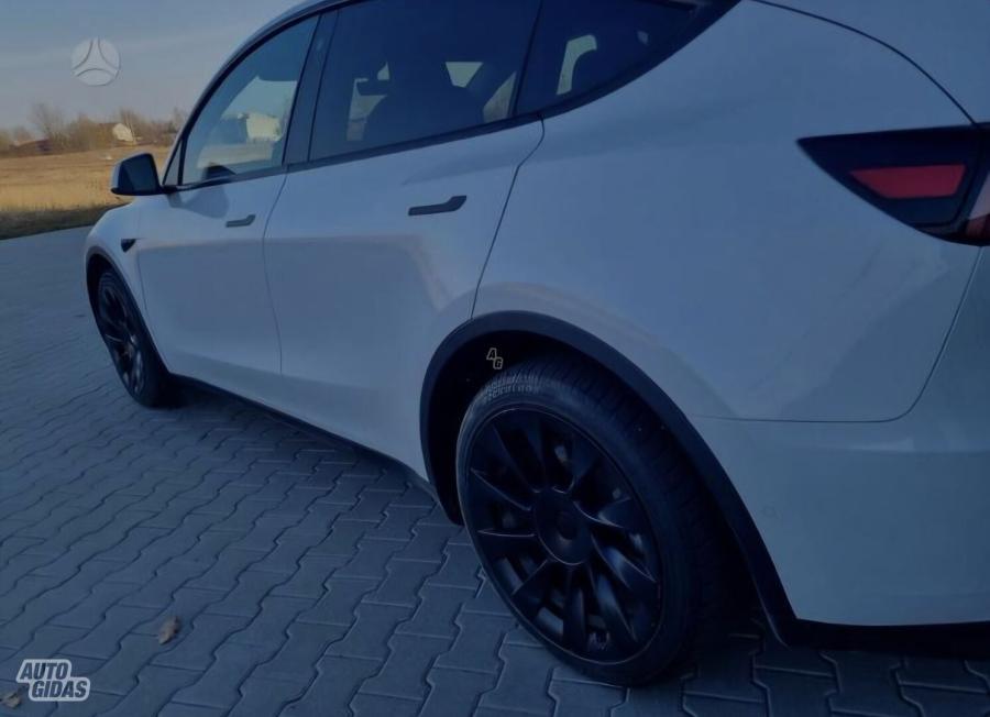 White Tesla Model Y 2022 in Siauliai, with an engine capacity of 0.00 L and mileage of 100 thousand km for 27500 €, photo 12 on AUTOMOTO.COM.LV