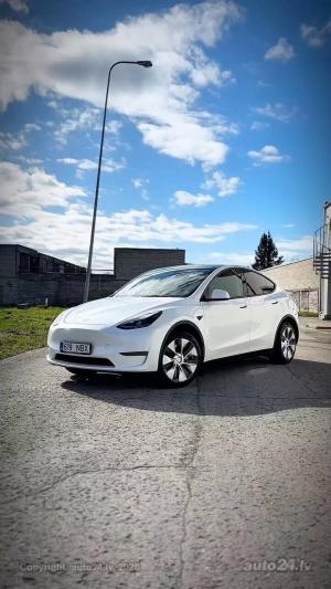 White Tesla Model Y 2022 in Tallinn, with an engine capacity of 0.00 L and mileage of 72 thousand km for 34000 €, photo  on AUTOMOTO.COM.LV