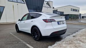 White Tesla Model Y 2022 in Parnu, with an engine capacity of 0.00 L and mileage of 56 thousand km for 37000 €, photo 6 on AUTOMOTO.COM.LV