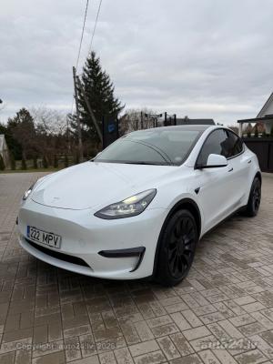 White Tesla Model Y 2022 in Tallinn, with an engine capacity of 0.00 L and mileage of 74 thousand km for 37000 €, photo 2 on AUTOMOTO.COM.LV