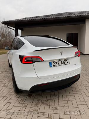 White Tesla Model Y 2022 in Tallinn, with an engine capacity of 0.00 L and mileage of 74 thousand km for 37000 €, photo 4 on AUTOMOTO.COM.LV