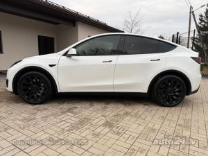 White Tesla Model Y 2022 in Tallinn, with an engine capacity of 0.00 L and mileage of 74 thousand km for 37000 €, photo 5 on AUTOMOTO.COM.LV
