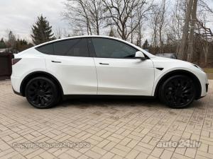 White Tesla Model Y 2022 in Tallinn, with an engine capacity of 0.00 L and mileage of 74 thousand km for 37000 €, photo 6 on AUTOMOTO.COM.LV