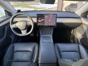 White Tesla Model Y 2022 in Tallinn, with an engine capacity of 0.00 L and mileage of 74 thousand km for 37000 €, photo 10 on AUTOMOTO.COM.LV