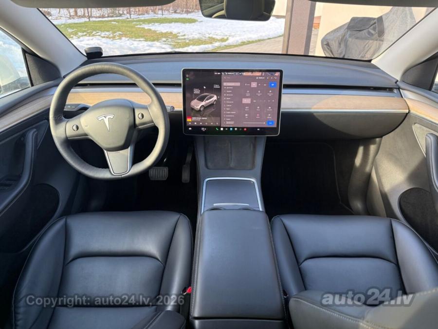 White Tesla Model Y 2022 in Tallinn, with an engine capacity of 0.00 L and mileage of 74 thousand km for 37000 €, photo 10 on AUTOMOTO.COM.LV