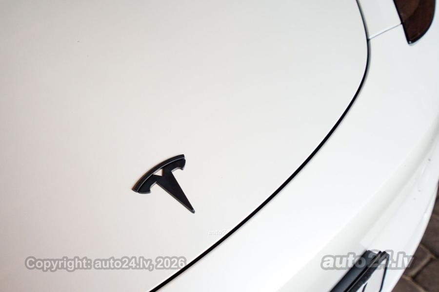 White Tesla Model Y 2022 in Tallinn, with an engine capacity of 0.00 L and mileage of 57 thousand km for 35490 €, photo 13 on AUTOMOTO.COM.LV