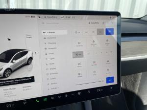 White Tesla Model Y 2022 in Vilnius, with an engine capacity of 0.00 L and mileage of 91 thousand km for 31500 €, photo 13 on AUTOMOTO.COM.LV