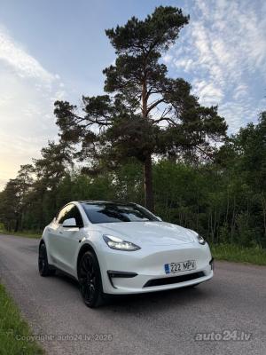White Tesla Model Y 2022 in Tallinn, with an engine capacity of 0.00 L and mileage of 80 thousand km for 33900 €, photo  on AUTOMOTO.COM.LV